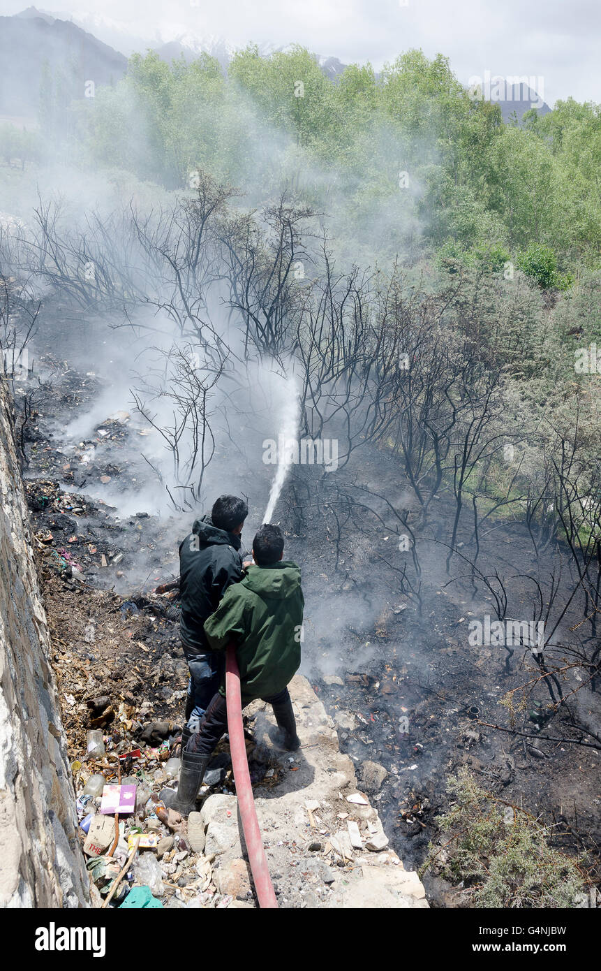 Fire fighters at scrub fire near Leh, Ladakh, Jammu and Kashmir, India ...