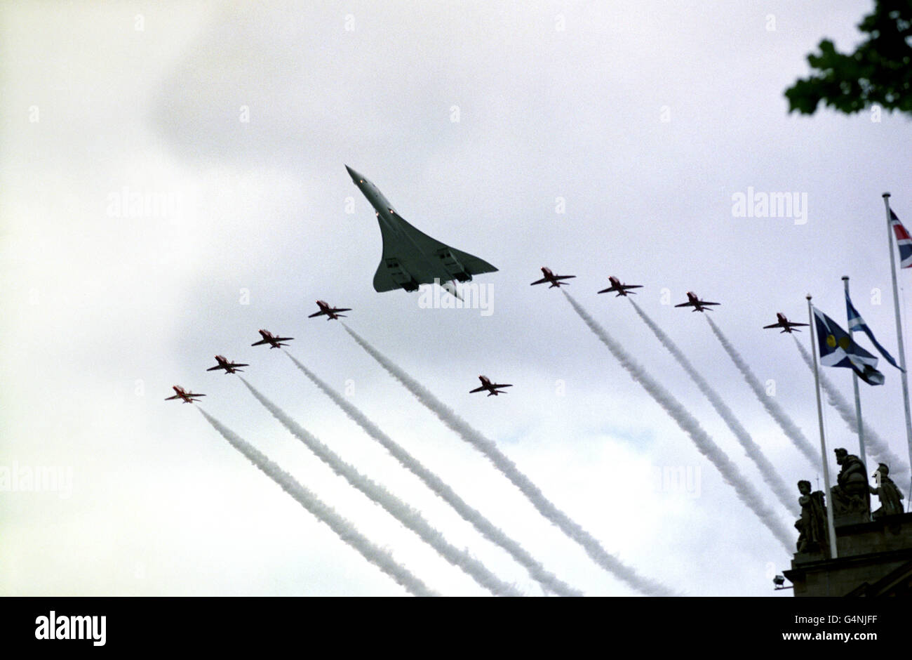 A Concorde jet leads the Red Arrows in a flypast after the Scottish ...