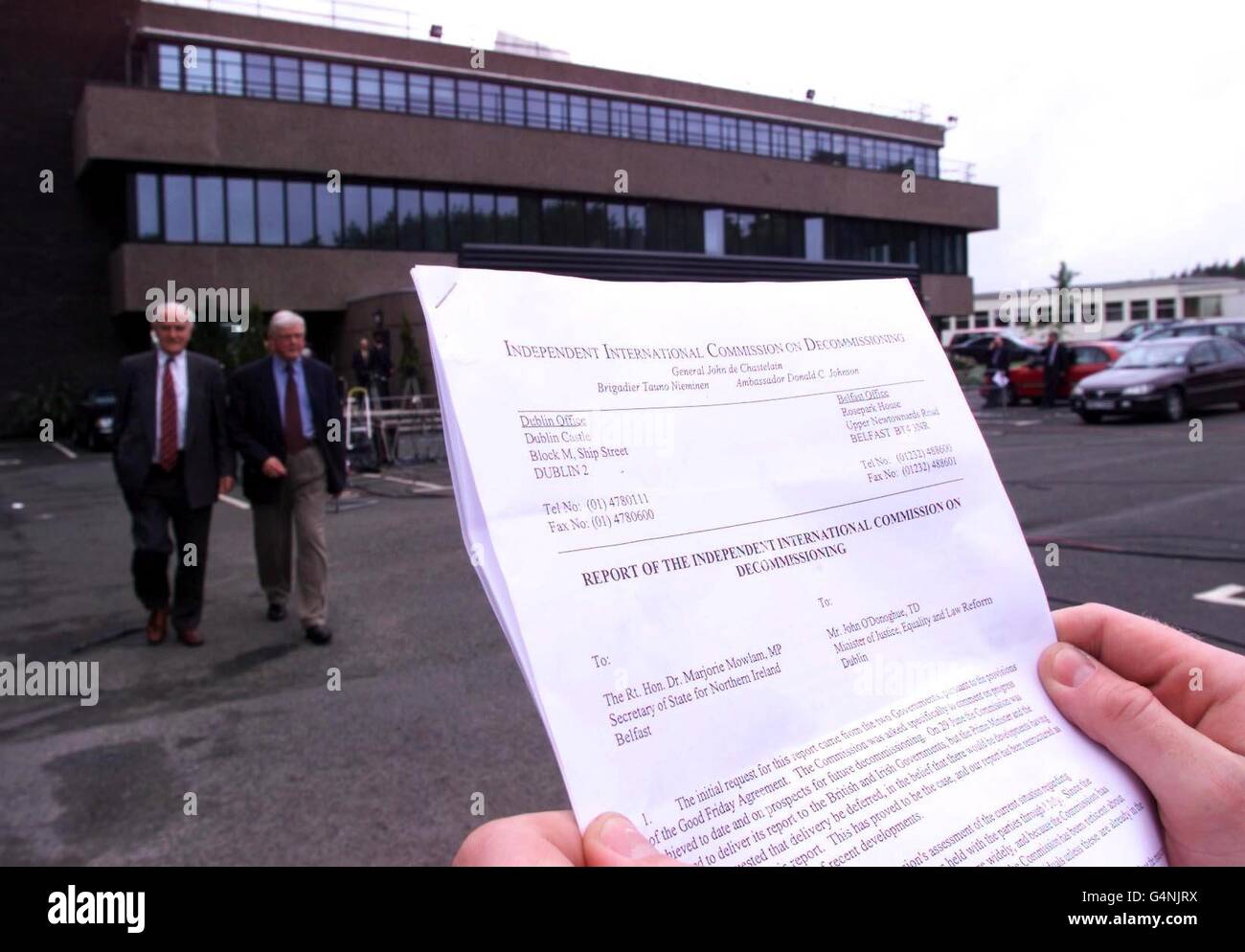 A journalist reads from the Decommissioning report handed down by ...