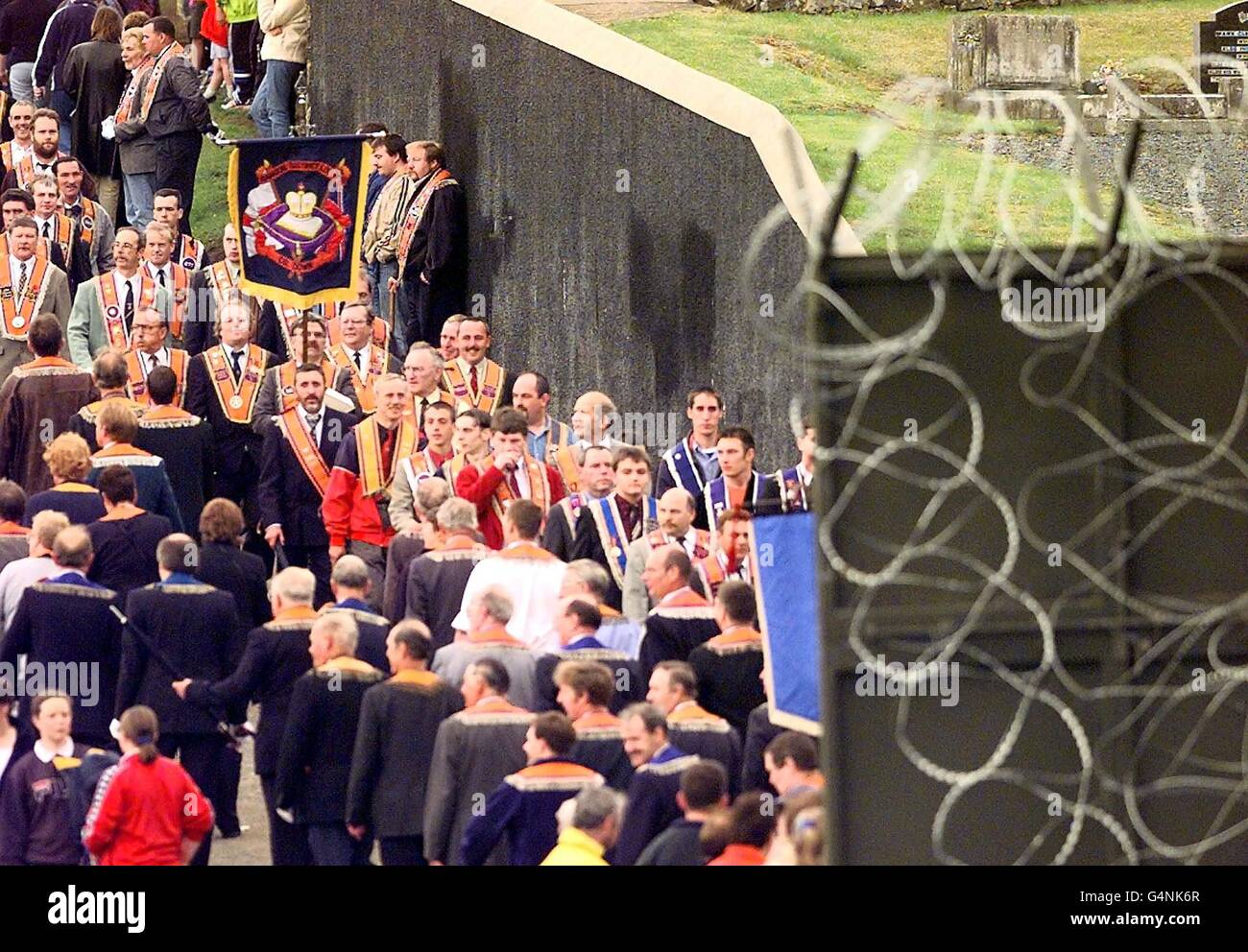 Orange Order marchers are turned back by the newly erected barrier near ...