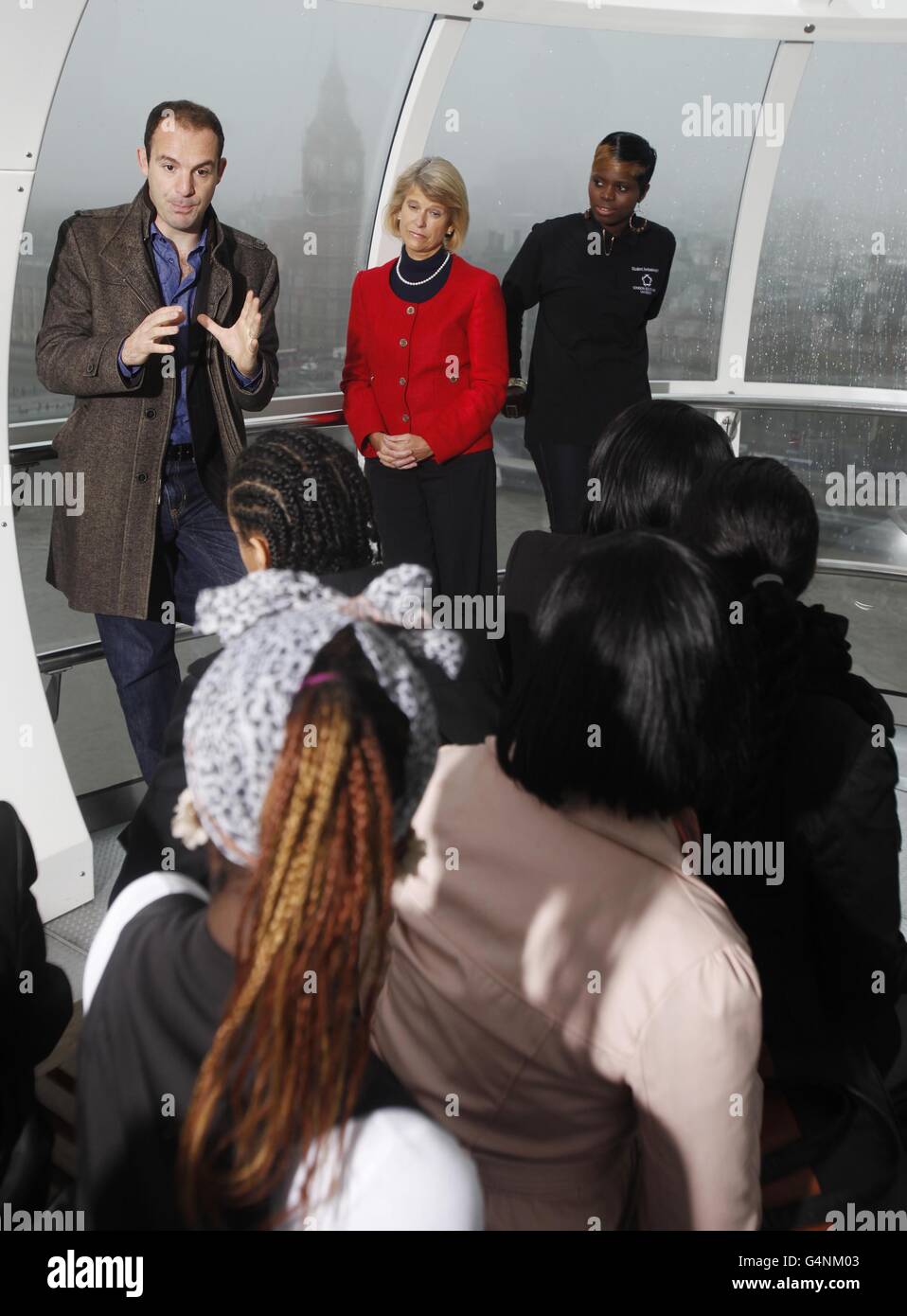 Martin Lewis (fifth left) founder of www.moneysavingexpert.com, speaks ...