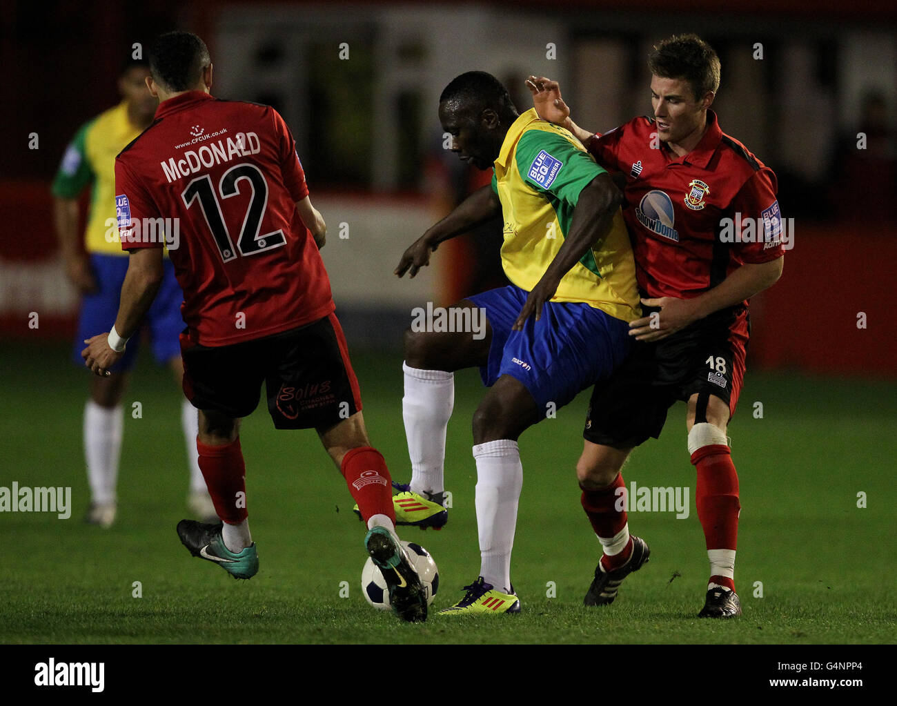 Tamworth's Liam McDonald (left) and Daniel Bradley and Kettering Town's ...