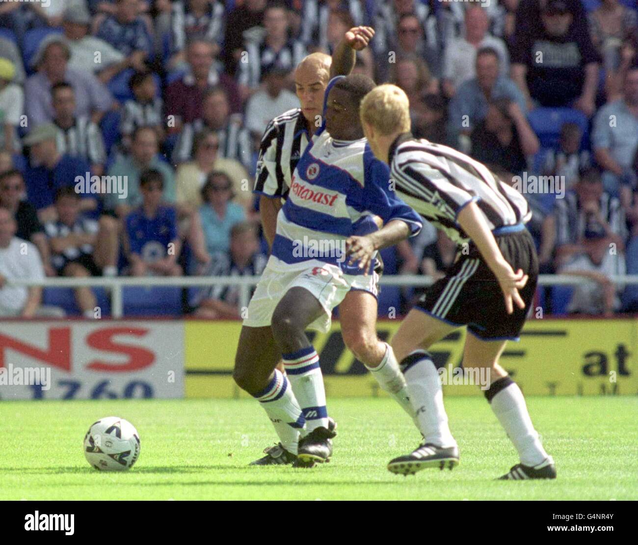 Reading forward Martin Williams (centre) is sandwiched between two ...