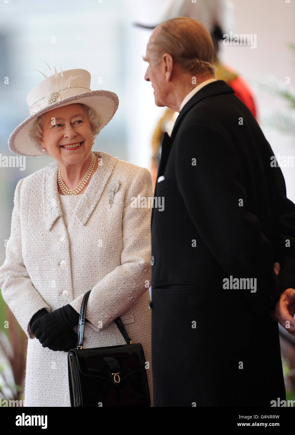 Queen Elizabeth II and the Duke of Edinburgh await the arrival of ...