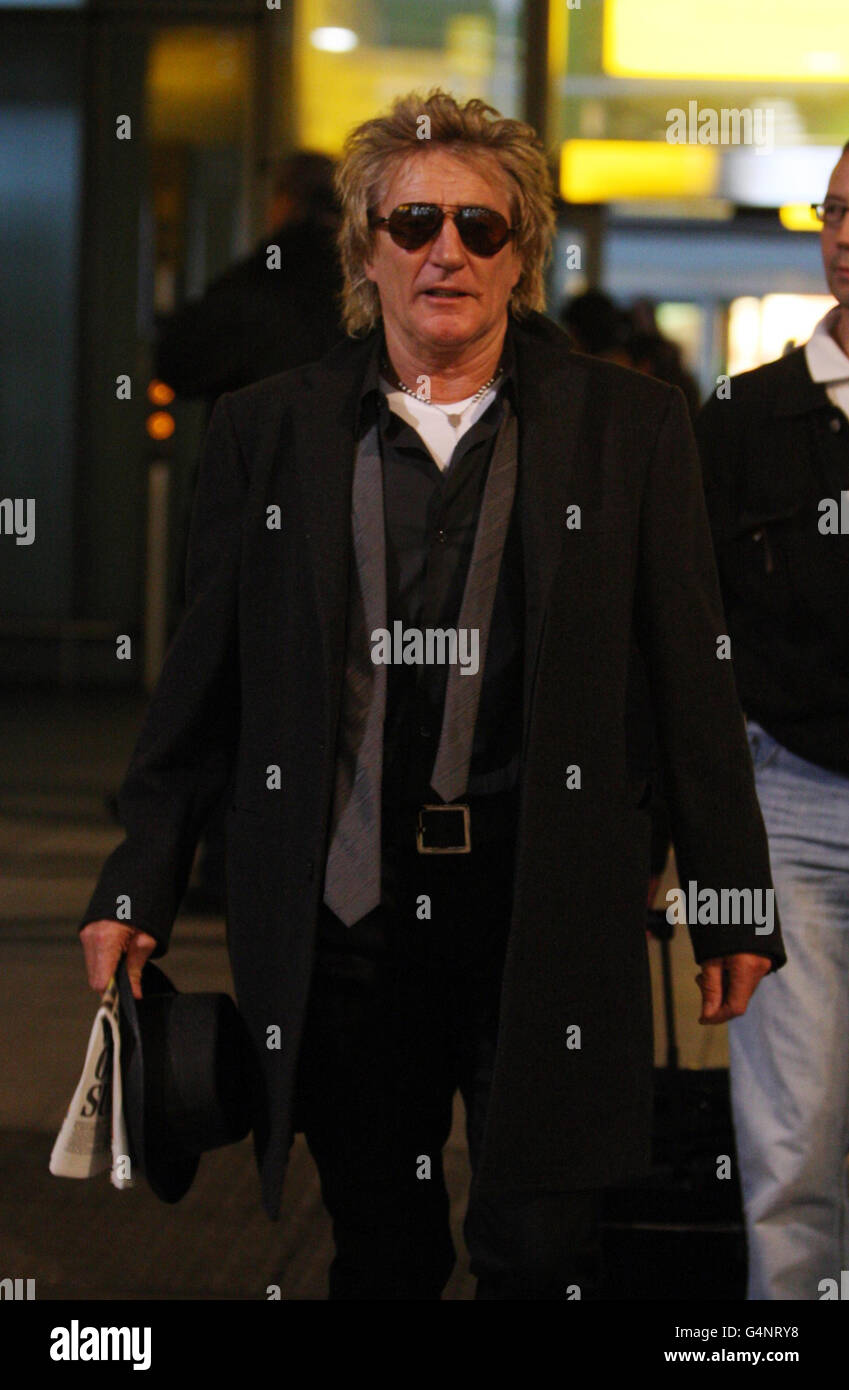 Rod stewart arrives at terminal 5 of heathrow airport hi-res stock ...