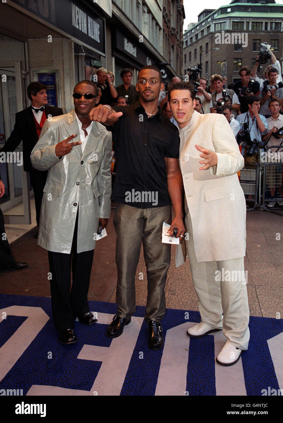 Members of the band Another Level and Richard Blackwood (centre) attend ...