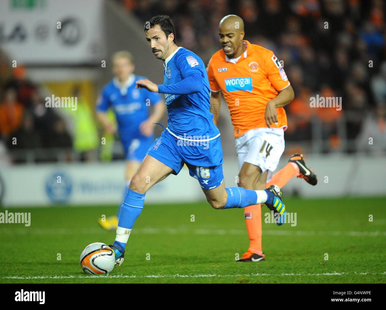 Birmingham City's Keith Fahey (left) and Blackpool's Ludovic Sylvestre ...