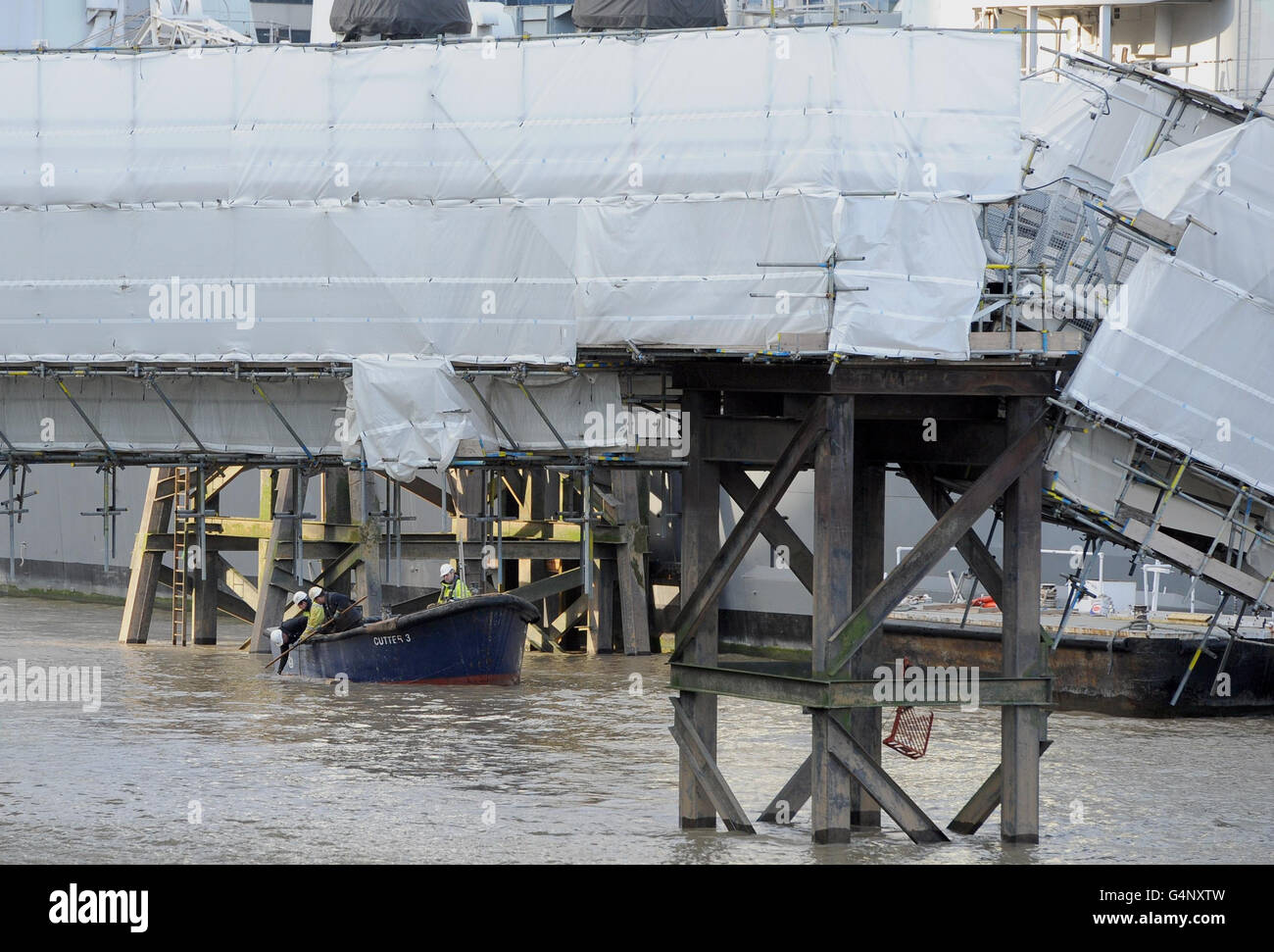 Officials search water gangway leading hms belfast collapsed into river ...