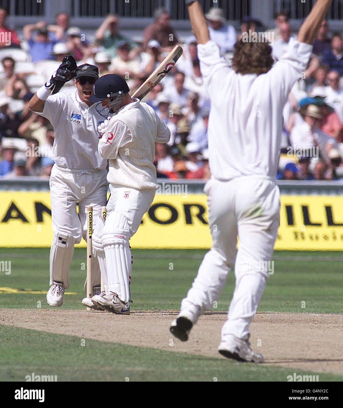 England's Darren Maddy (centre)is bowled out by New Zealander Daniel ...