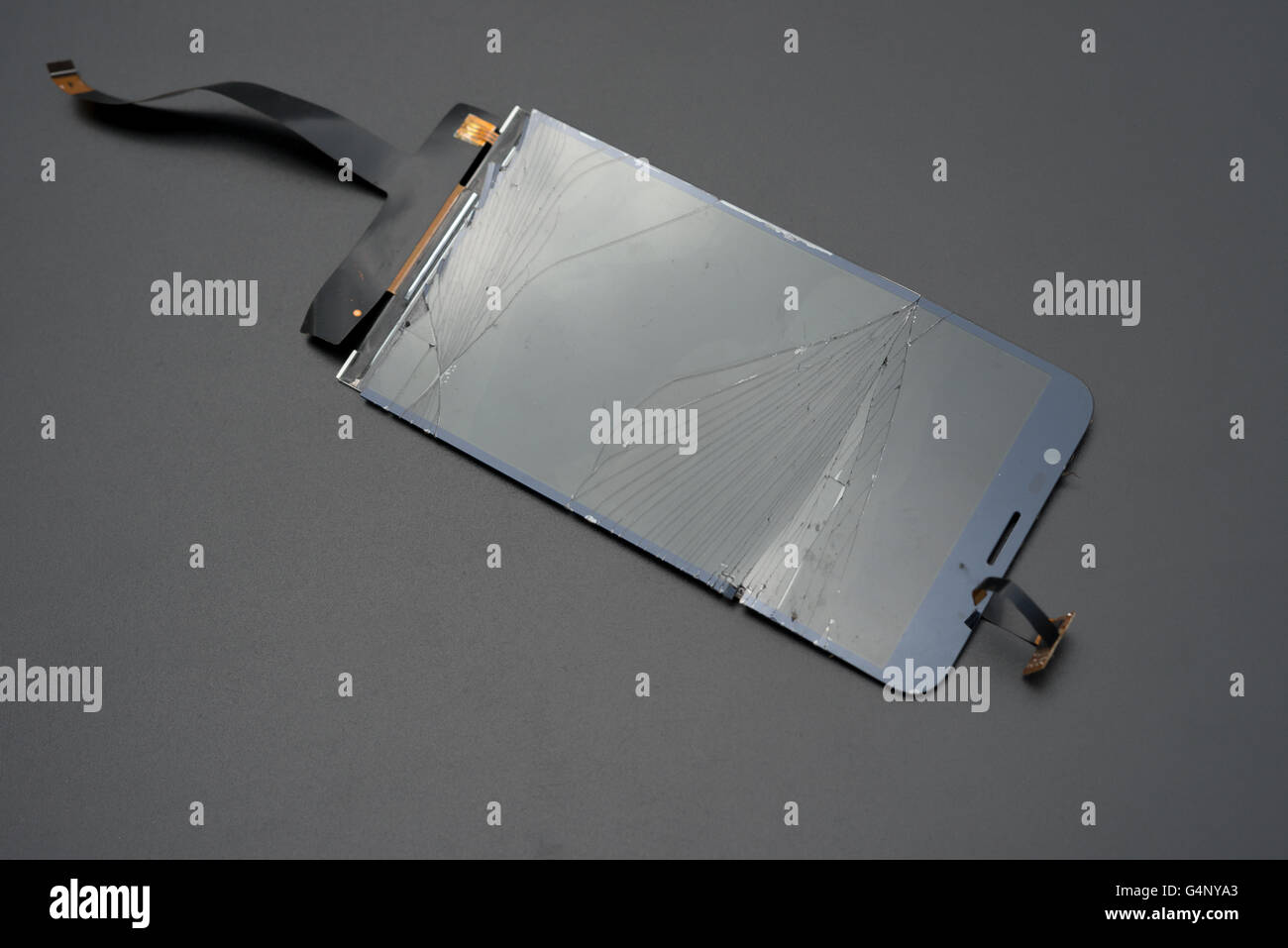broken screen of a smart phone on a black background Stock Photo - Alamy