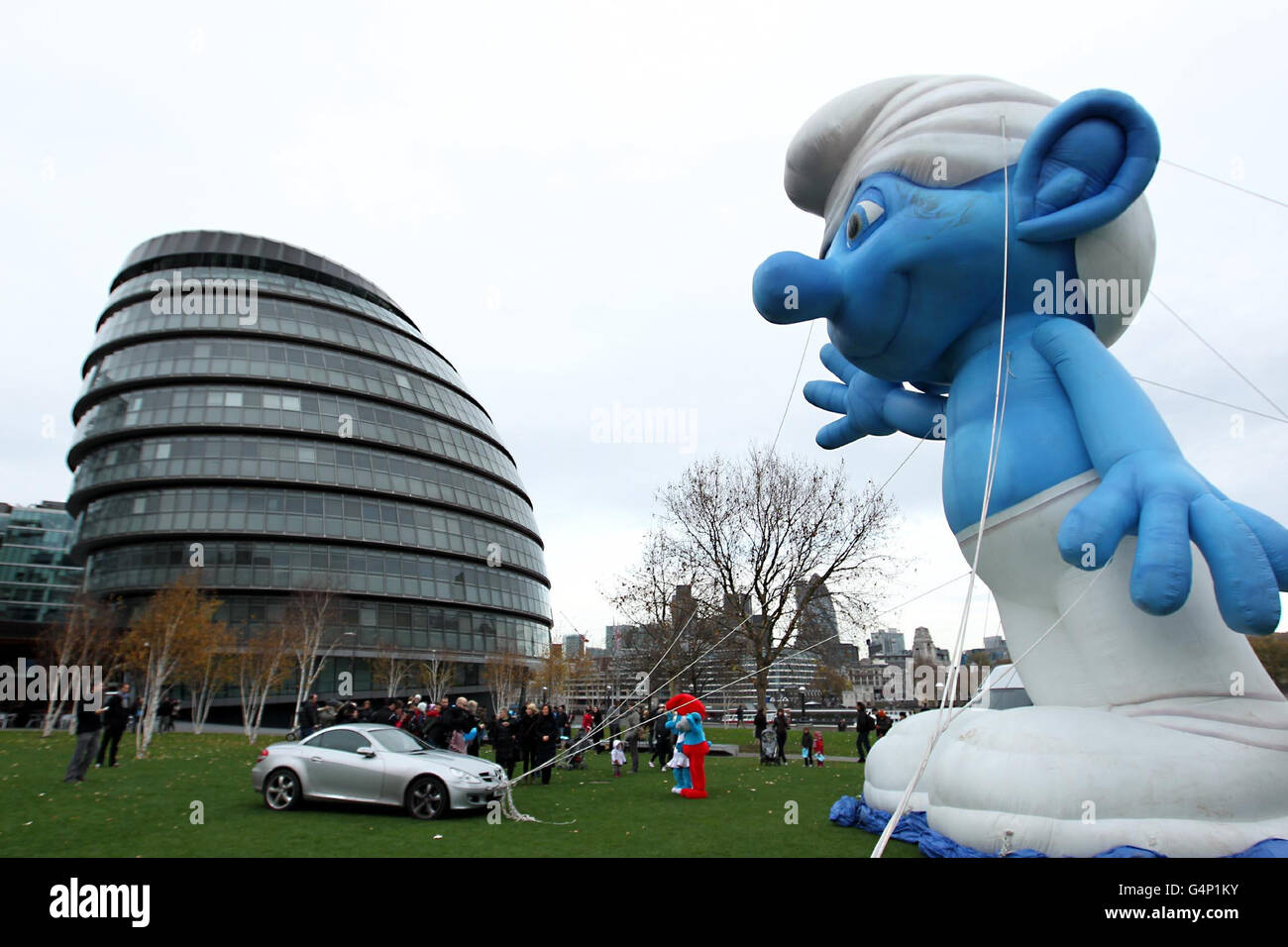 A large inflatable Smurf next to Tower Bridge in central London, to ...