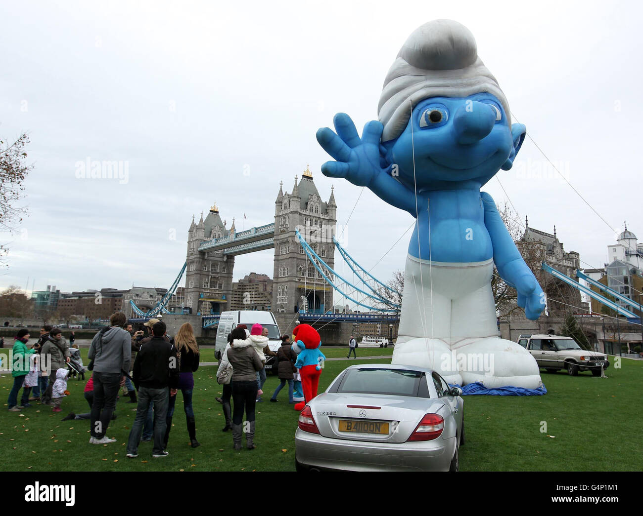 A large inflatable Smurf next to Tower Bridge in central London, to ...