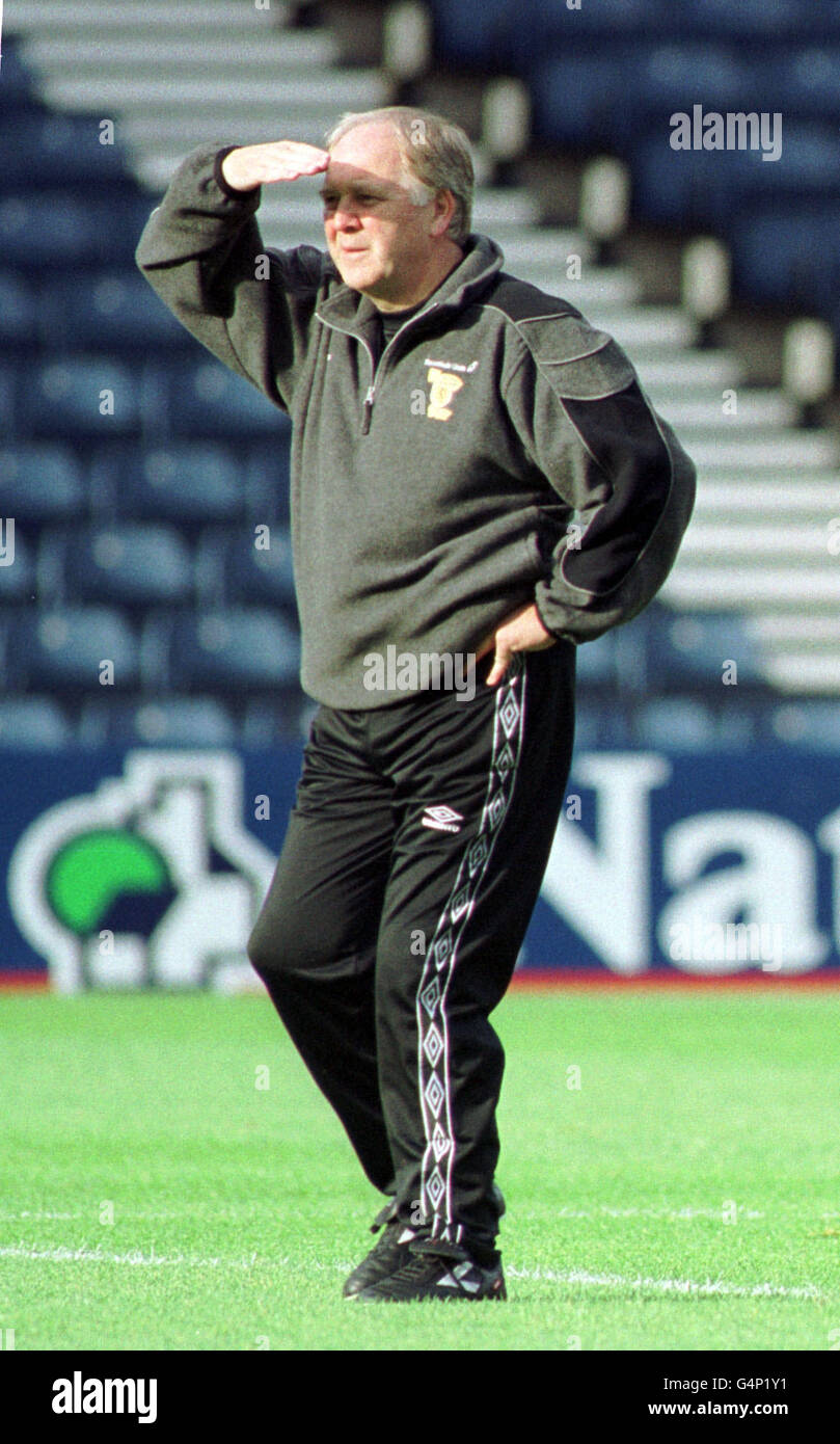 Scotland Manager Craig Brown keeps an eye on the team during practice ...