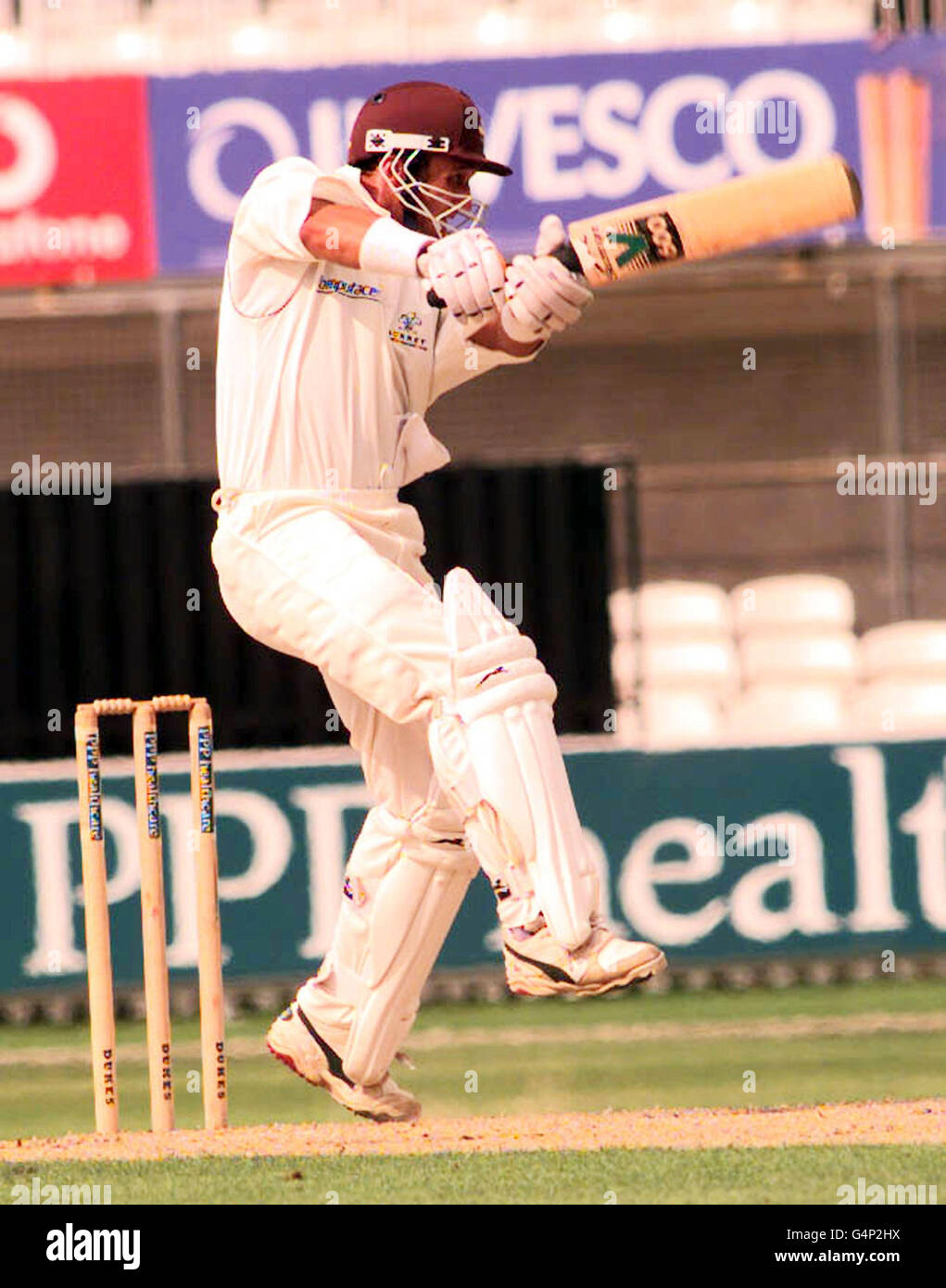 Surrey batsman Mark Ward hits off Nottinghamshire bowler Paul Franks ...