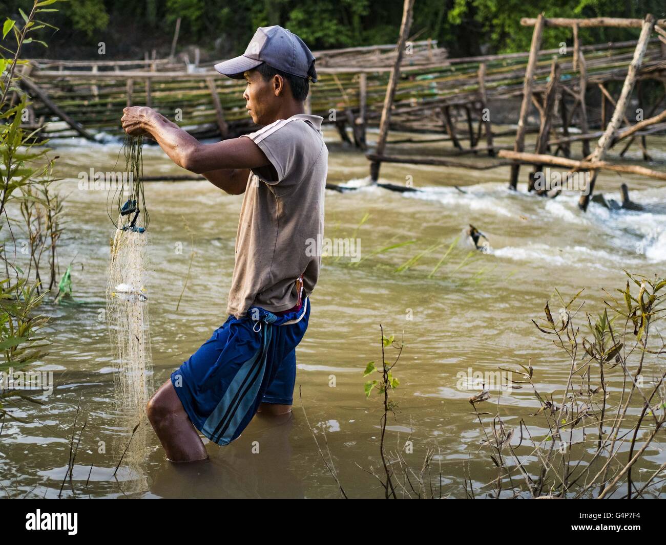 Fisherman pulls fish out water hi-res stock photography and images - Alamy