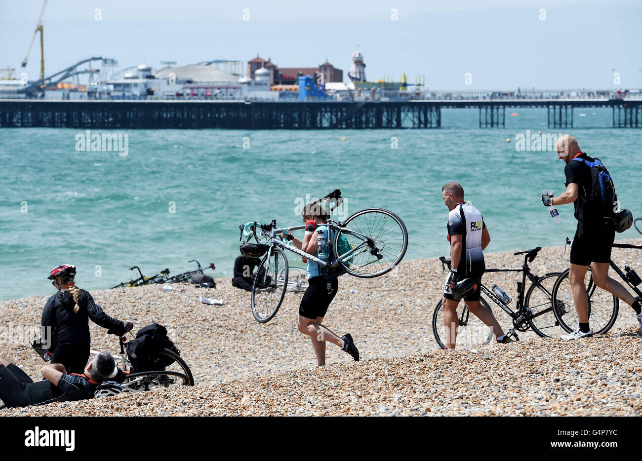 Brighton, UK. 19th June 2016. Cyclists head for the beach after ...