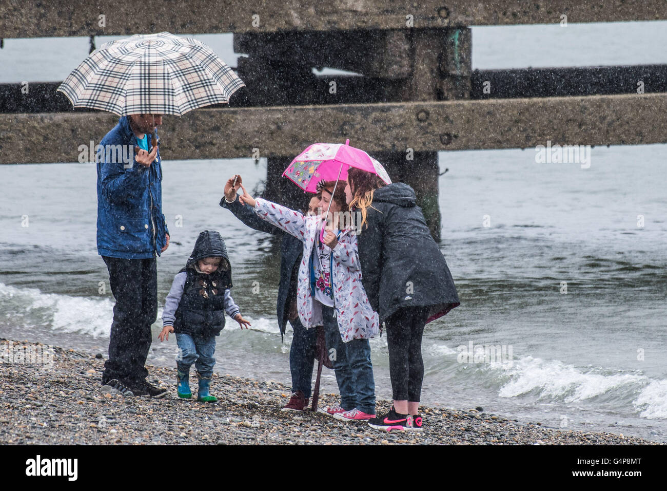 2016 wet rain family wales uk hi-res stock photography and images - Alamy