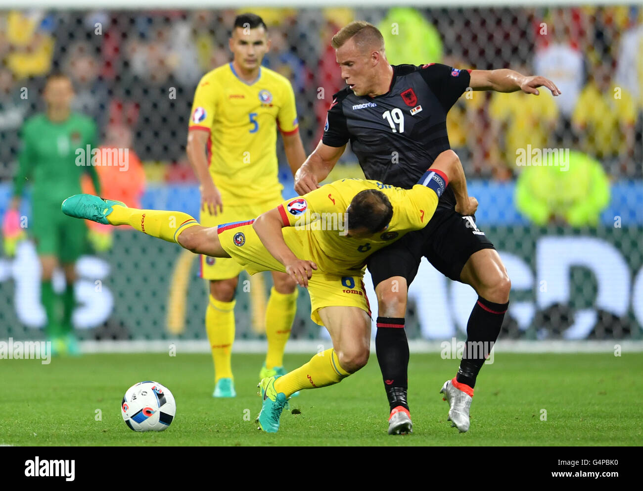Lyon, France. 19th June, 2016. Bekim Balaj (R) of Albania vies with ...