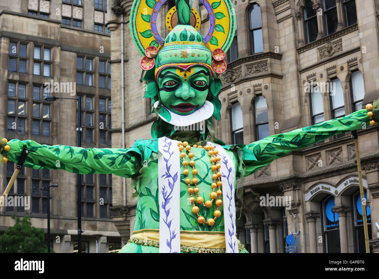 Manchester, UK. 19th June, 2016. A green life size statue is paraded ...