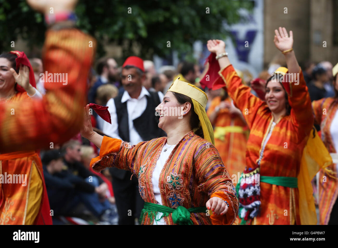 Manchester, UK. 19th June, 2016. Dancers in traditional clothes ...