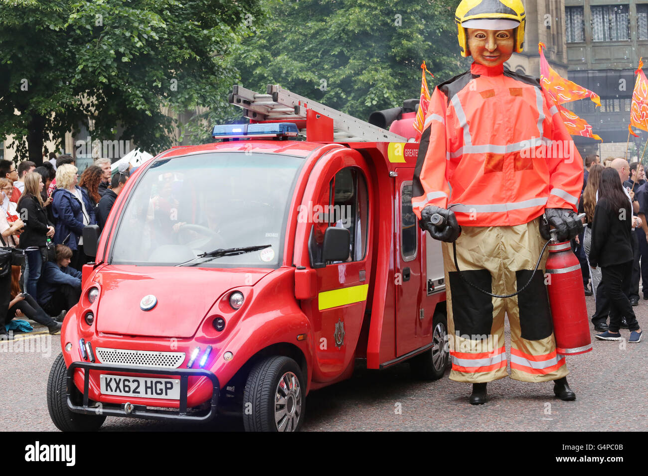 Manchester, UK. 19th June, 2016. A miniature fire engine and a giant ...