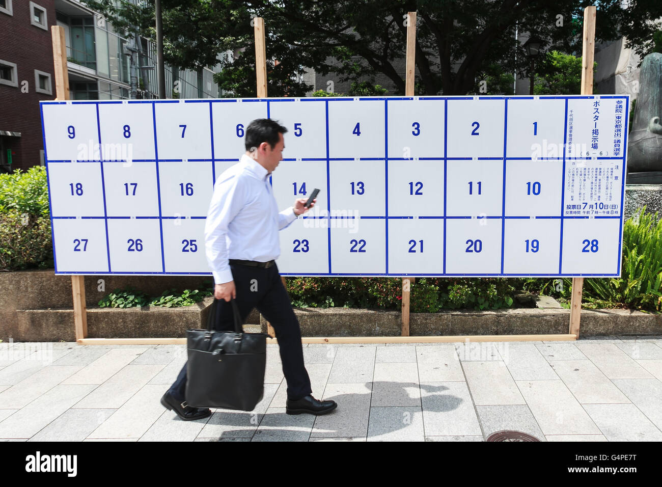 Man putting up posters hi-res stock photography and images - Alamy