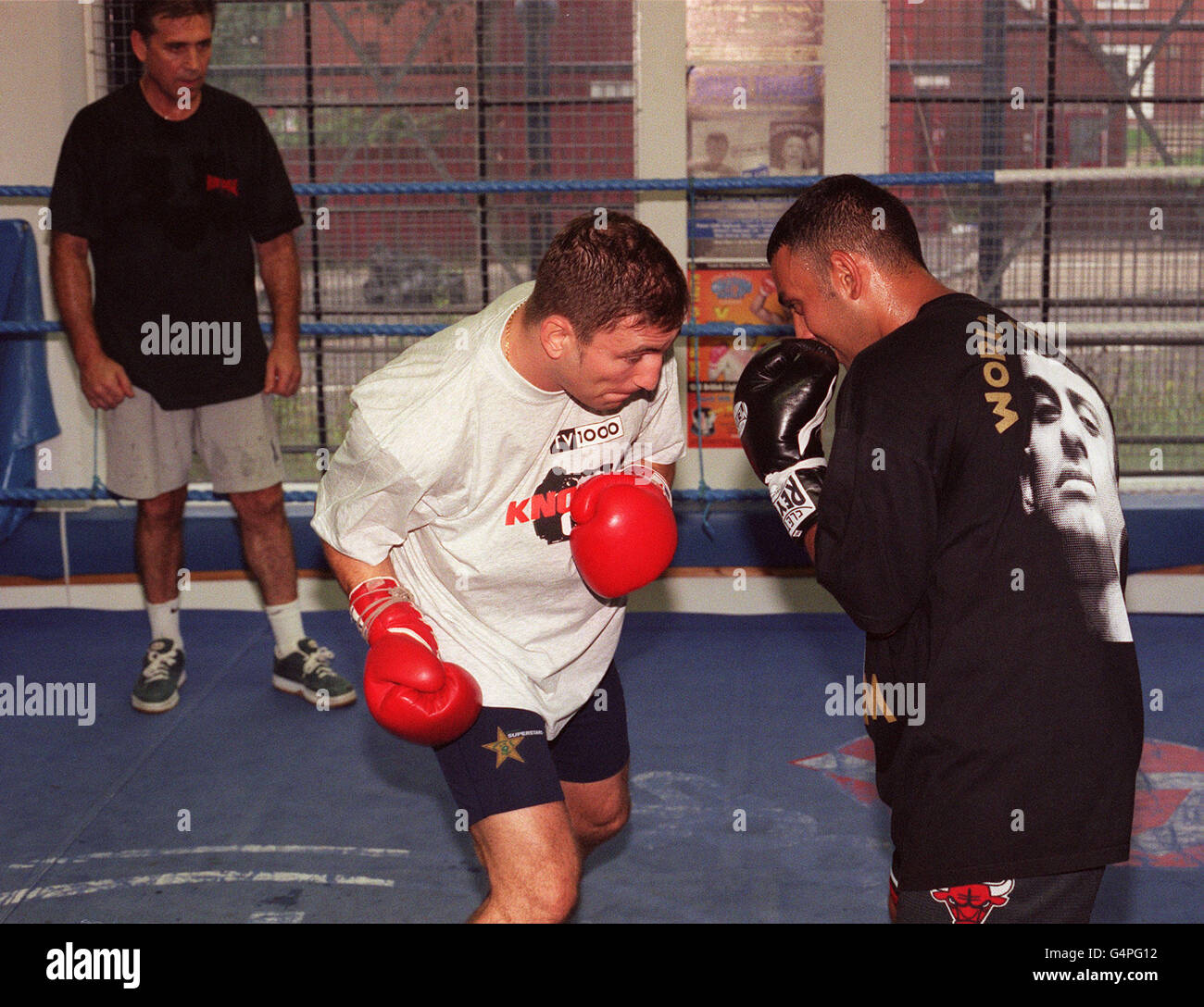 Swedish boxer Paolo Roberto (centre) during a sparring session with ...