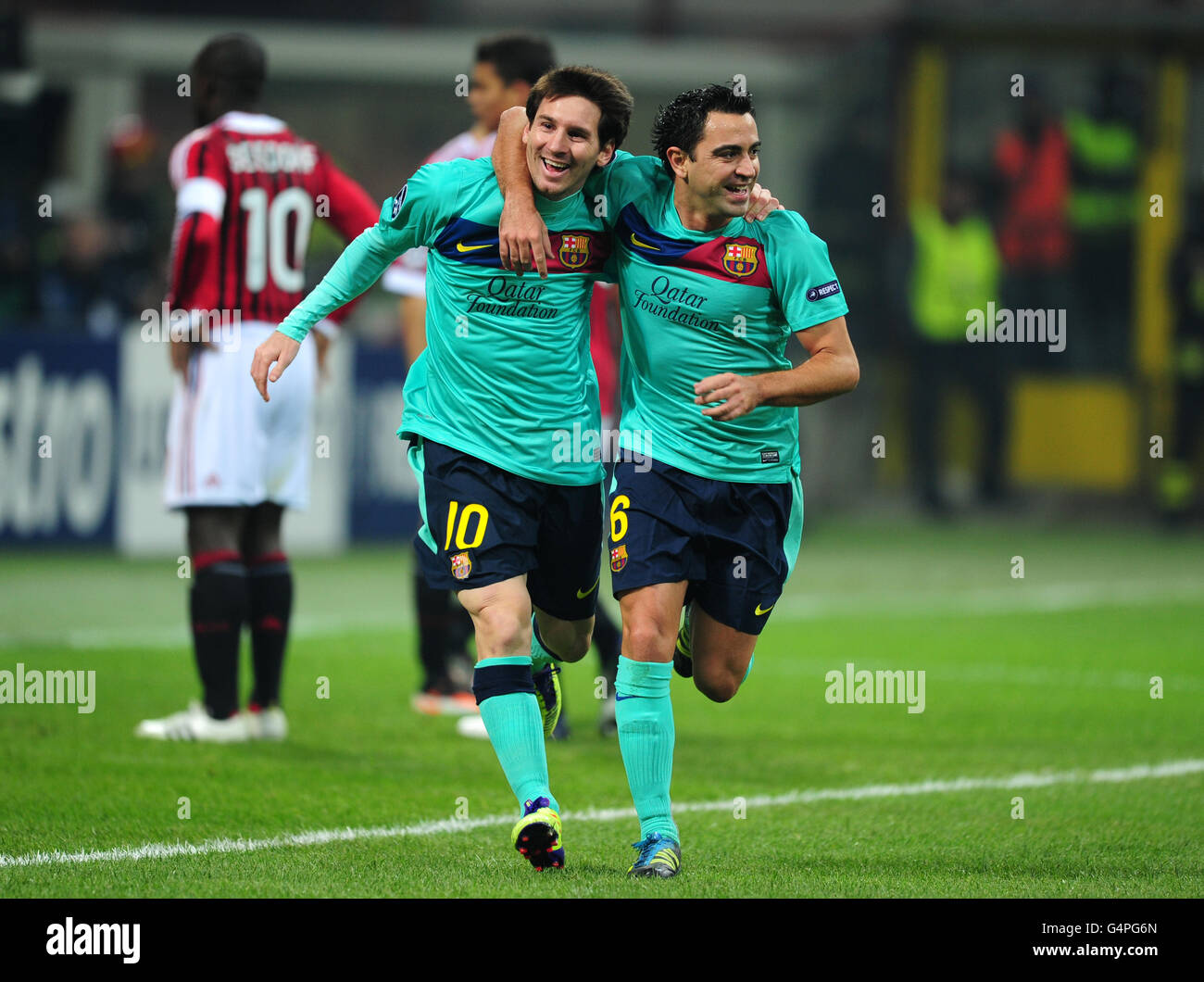 Barcelonas lionel messi left and xavi celebrate the first goal hi-res ...