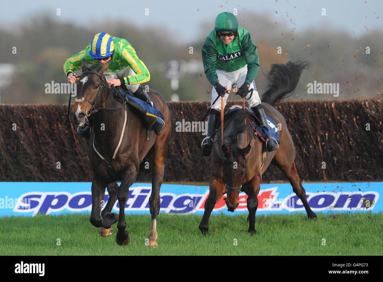 Educated Evans ridden by Sam Twiston-Davies (left) clears the last ...