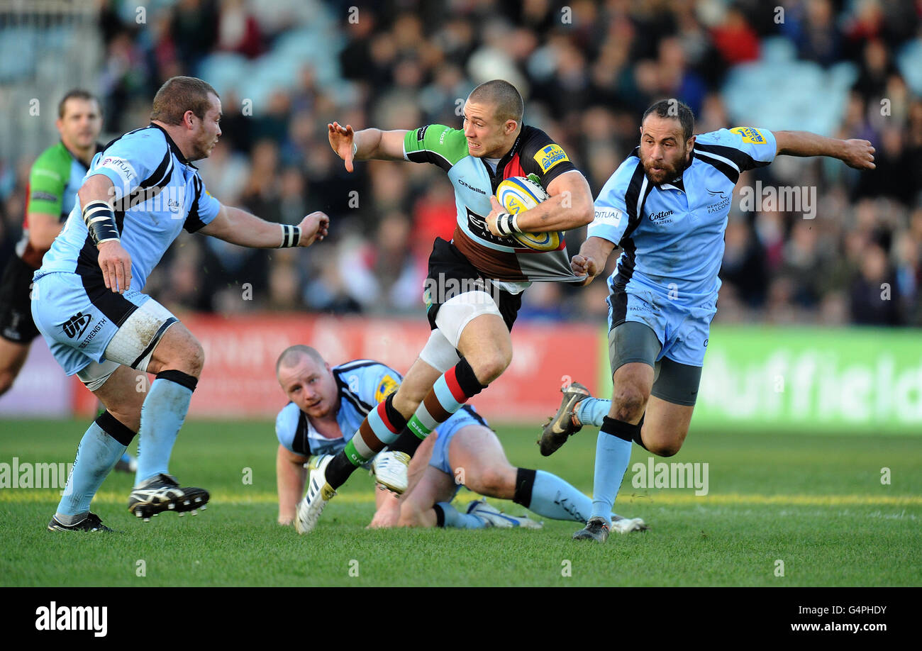 Harlequins' Mike Brown and Newcastle Falcons' James Hall (left) and ...
