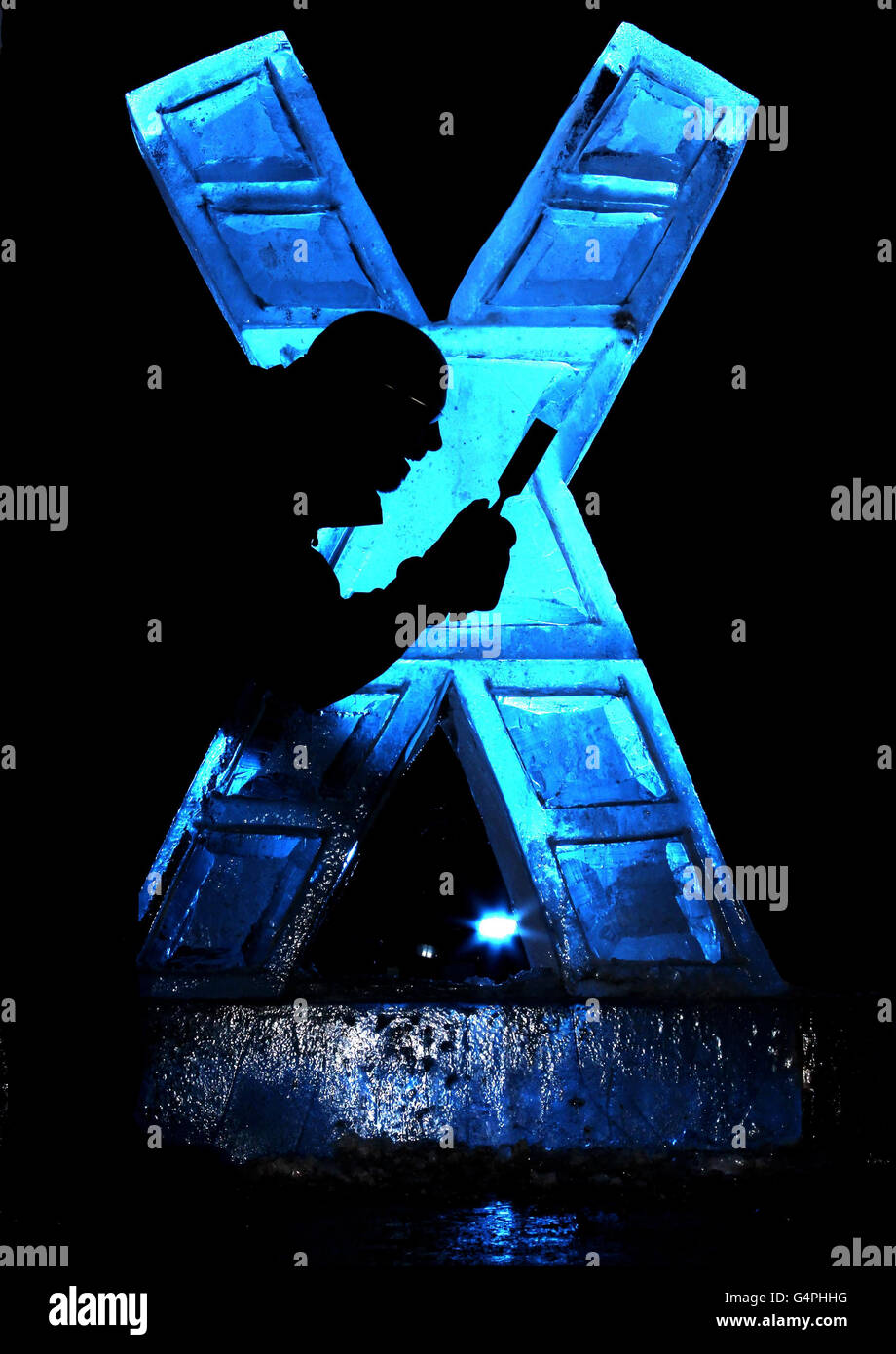 Ice Sculpture artist Mark Cowan from UK Ice Sculptures creates a cross ...