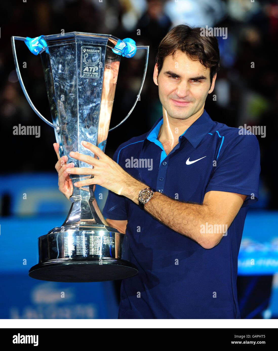 Switzerland's Roger Federer celebrates with the trophy after defeating ...