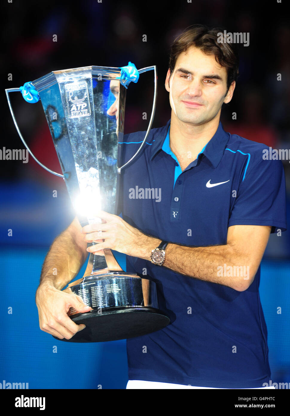 Switzerland's Roger Federer celebrates with the trophy after defeating ...