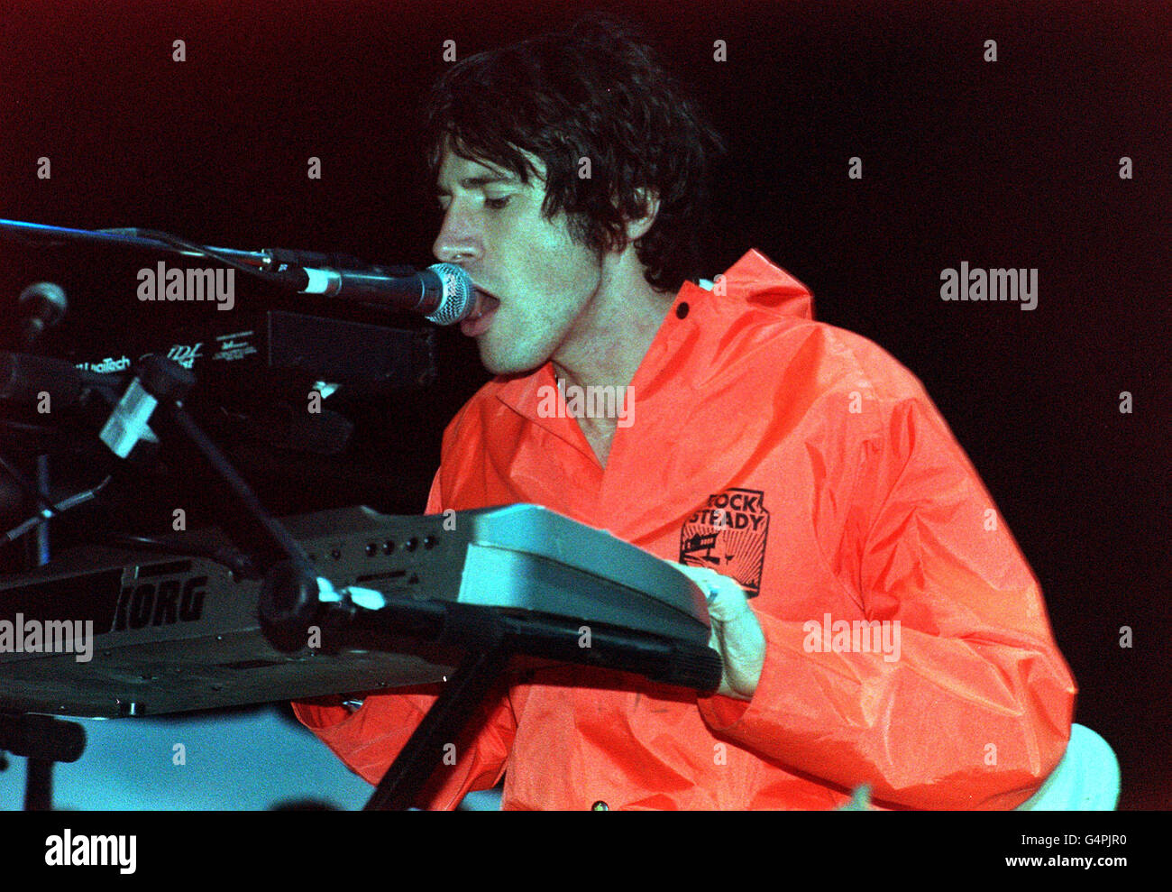 Gruff Rhys of the band Super Furry Animals performing on stage to a ...