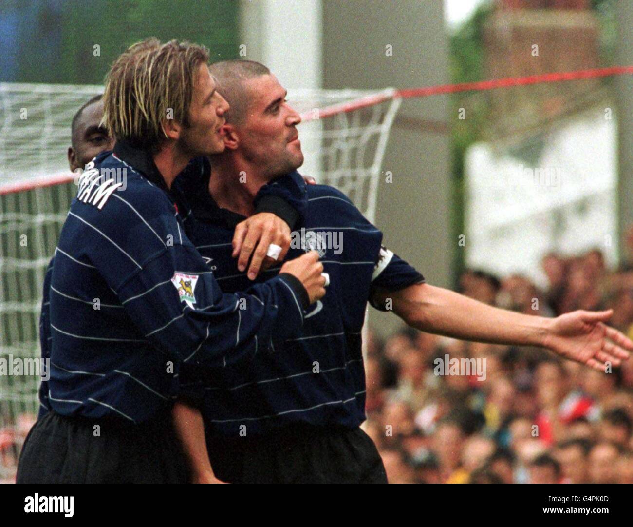 David Beckham congratulates his Manchester United colleague Roy Keane ...