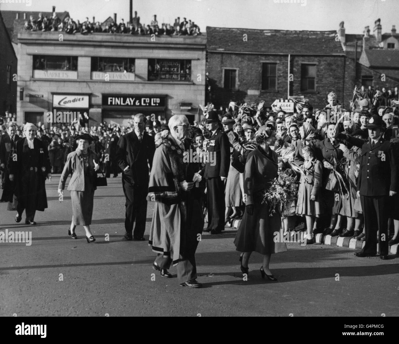 Queen Elizabeth II arriving at the Town Hall in Dewsbury, with the ...