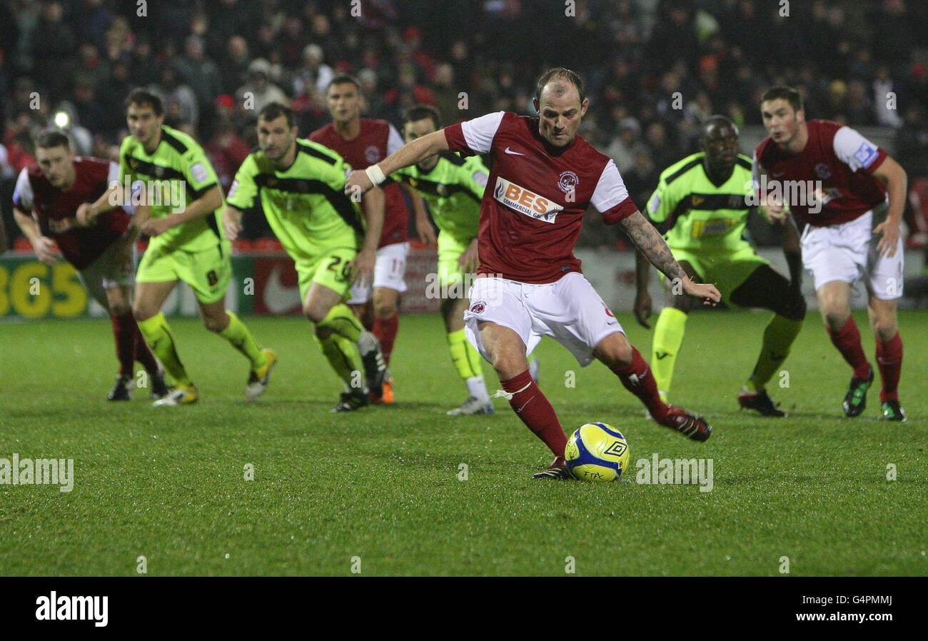 Fleetwood Town's Jamie Milligan scores from the penalty spot to earn ...