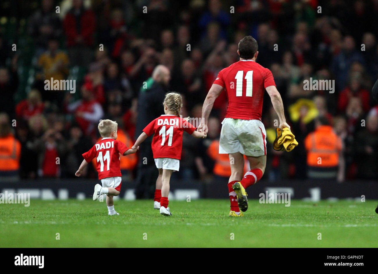 Wales' Shane Williams walks with his children as he retires from ...