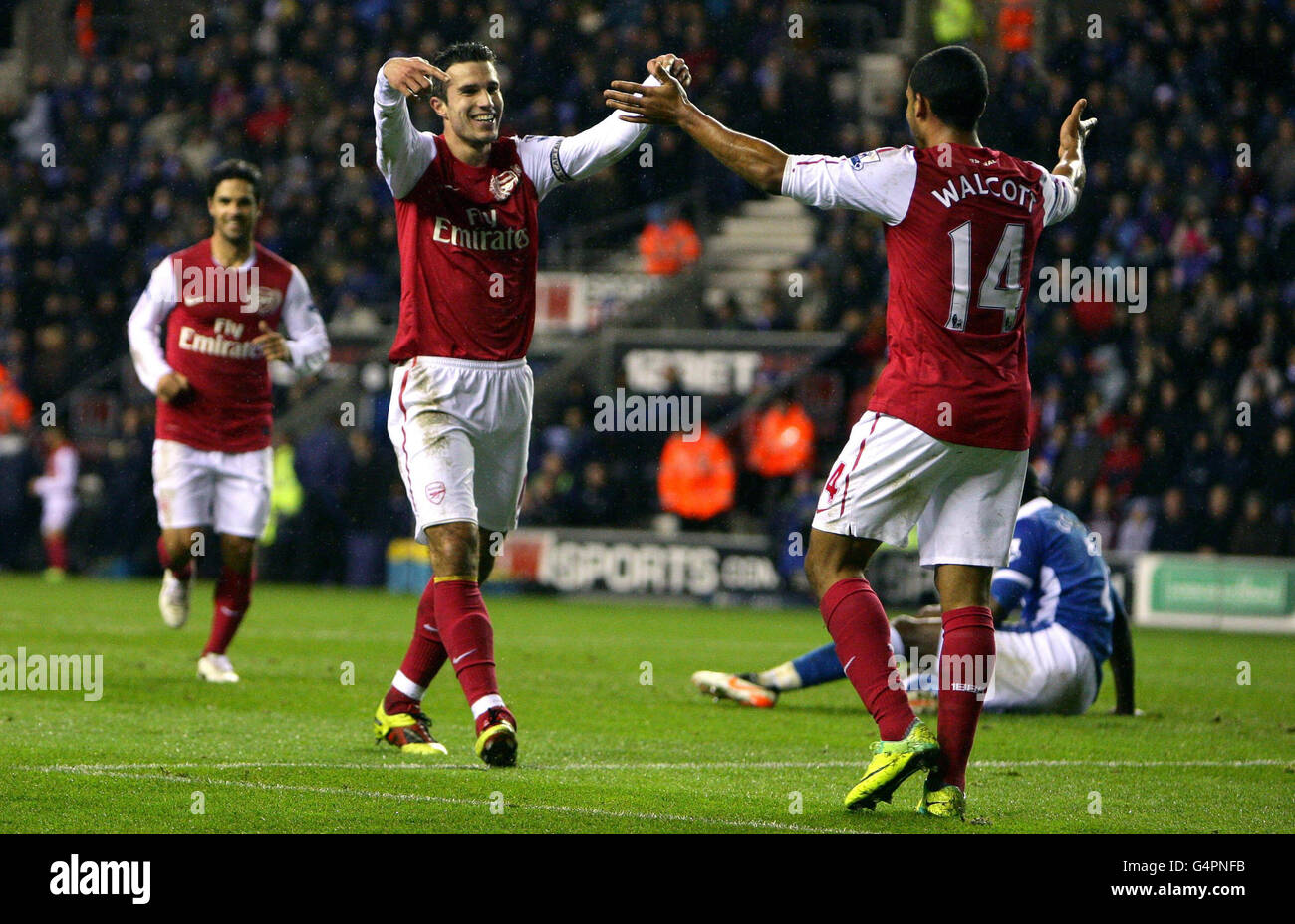 Arsenal's Robin Van Persie celebrates his goal with Theo Walcott during ...