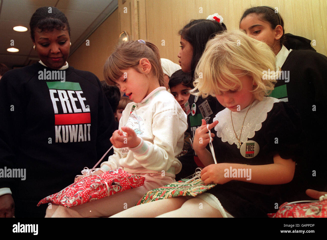 Mona Salim from Kuwait watches (left) Kimberley Kitts, aged 6, and ...