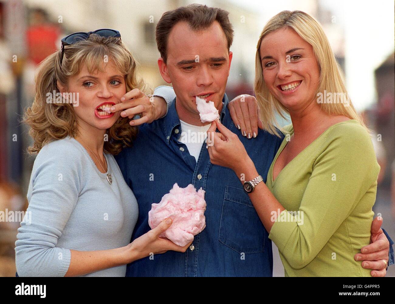 Members of the cast of TV soap EastEnders relax at Brighton during a ...