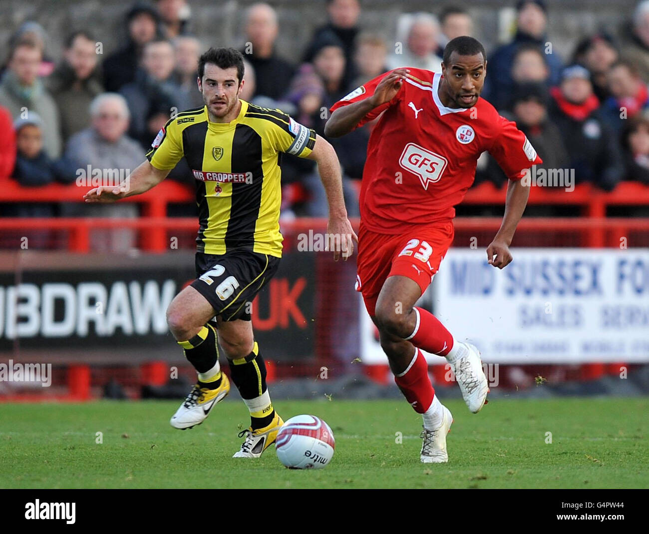 Burton Albion's Adam Bolder (left) and Crawley Town's Tyrone Barnett ...