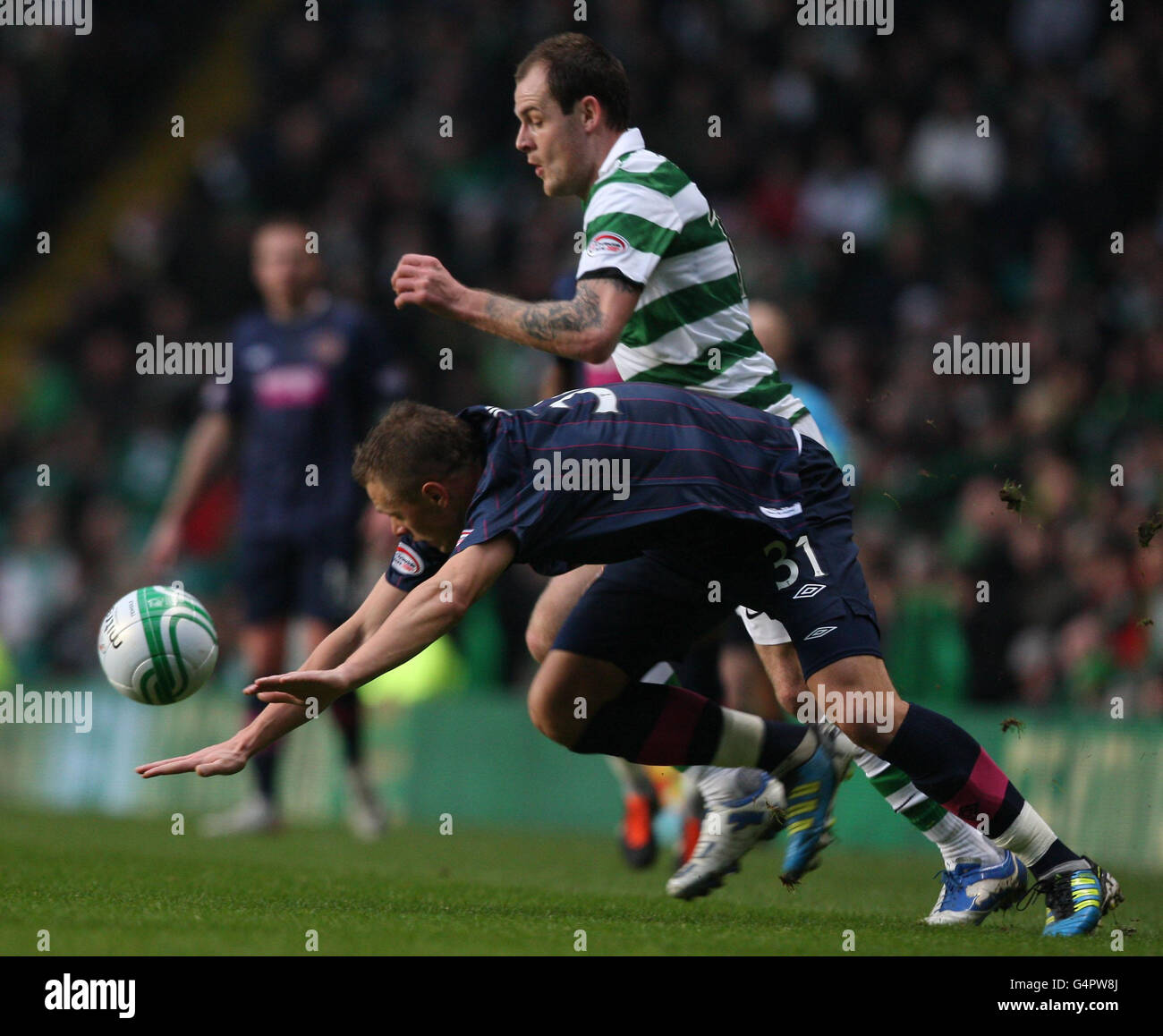 Celtics Anthony Stokes holds off Hearts Adrian Mrowiec during the ...