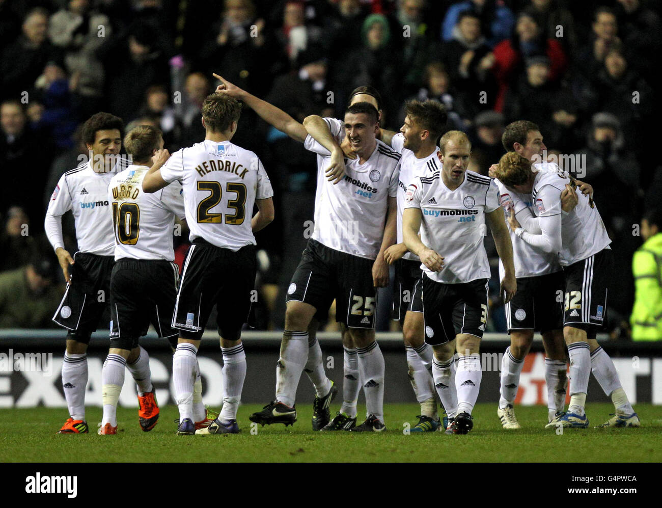 Derby County's Callum Ball (centre) celebrates scoring the winning goal ...