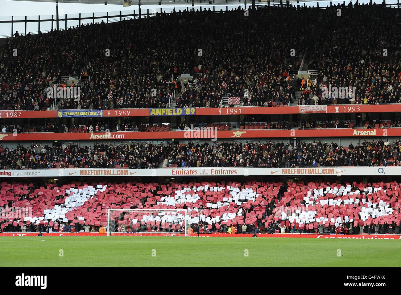 Arsenal fans in stands holding hi-res stock photography and images - Alamy