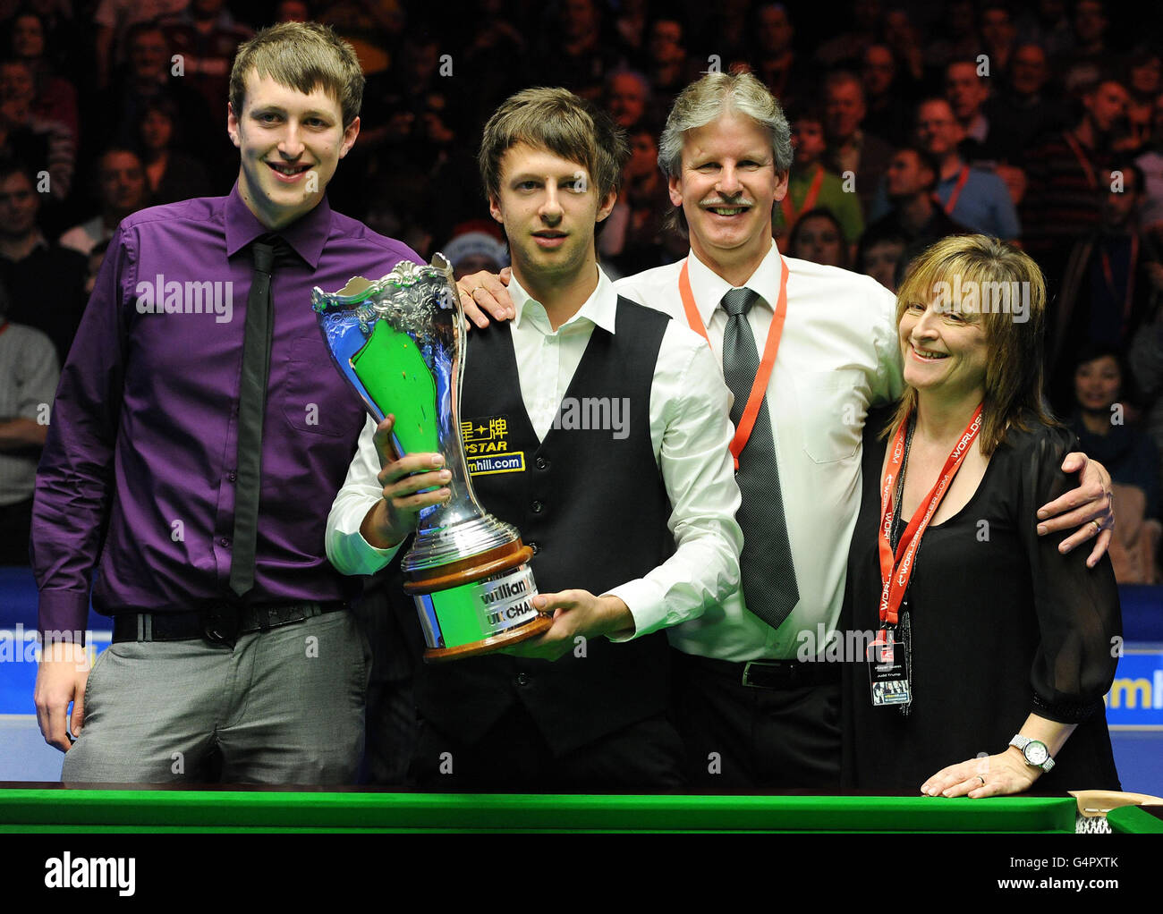 England's Judd Trump celebrates with his family (left to right) brother ...