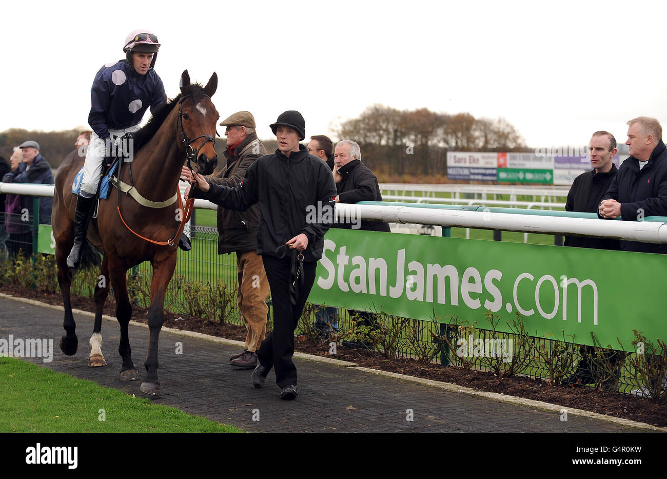 Jockey Henry Oliver on Lackamon is lead around the parade ring at ...