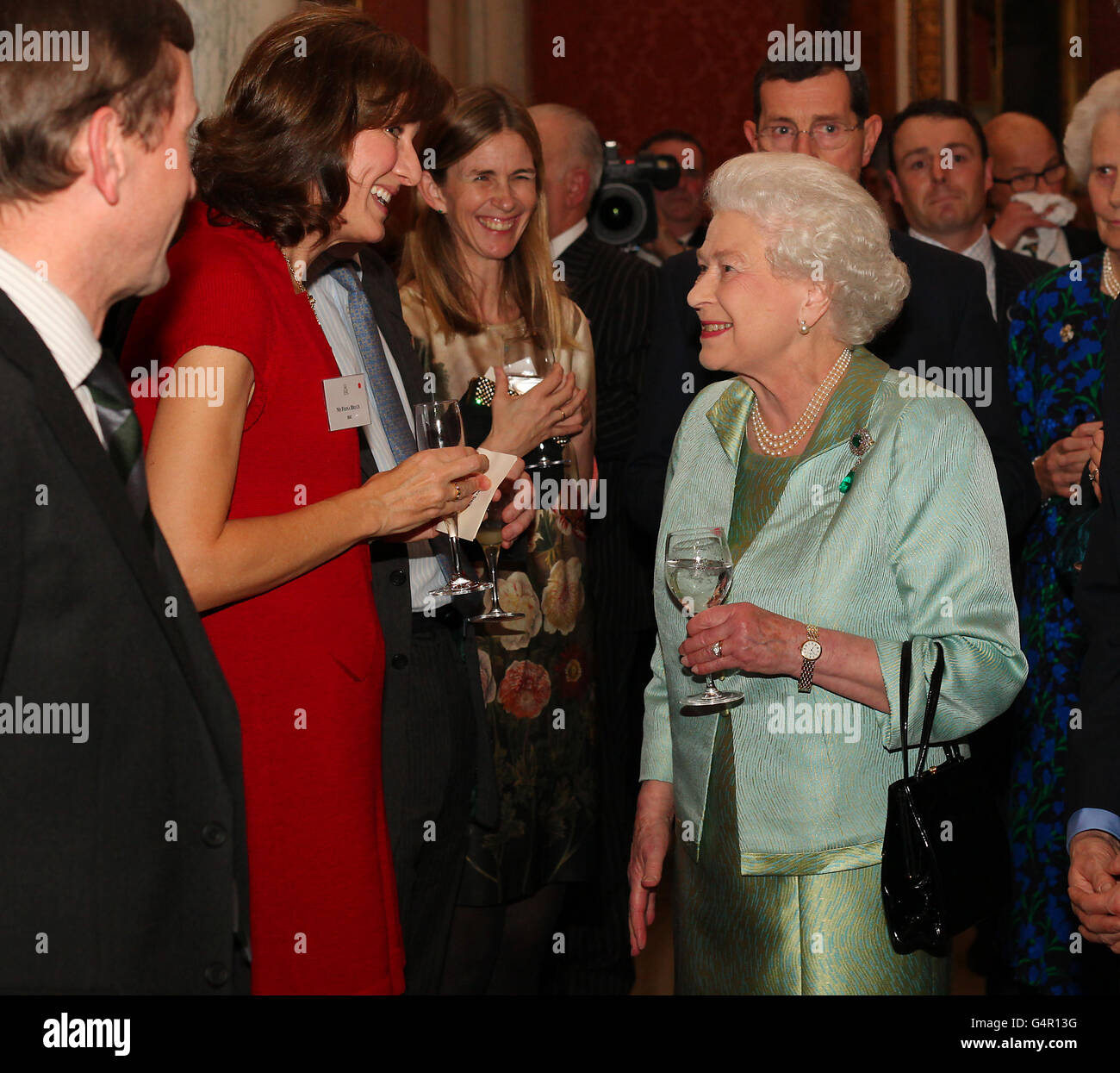 Queen Elizabeth II meets Fiona Bruce during a reception for members of ...