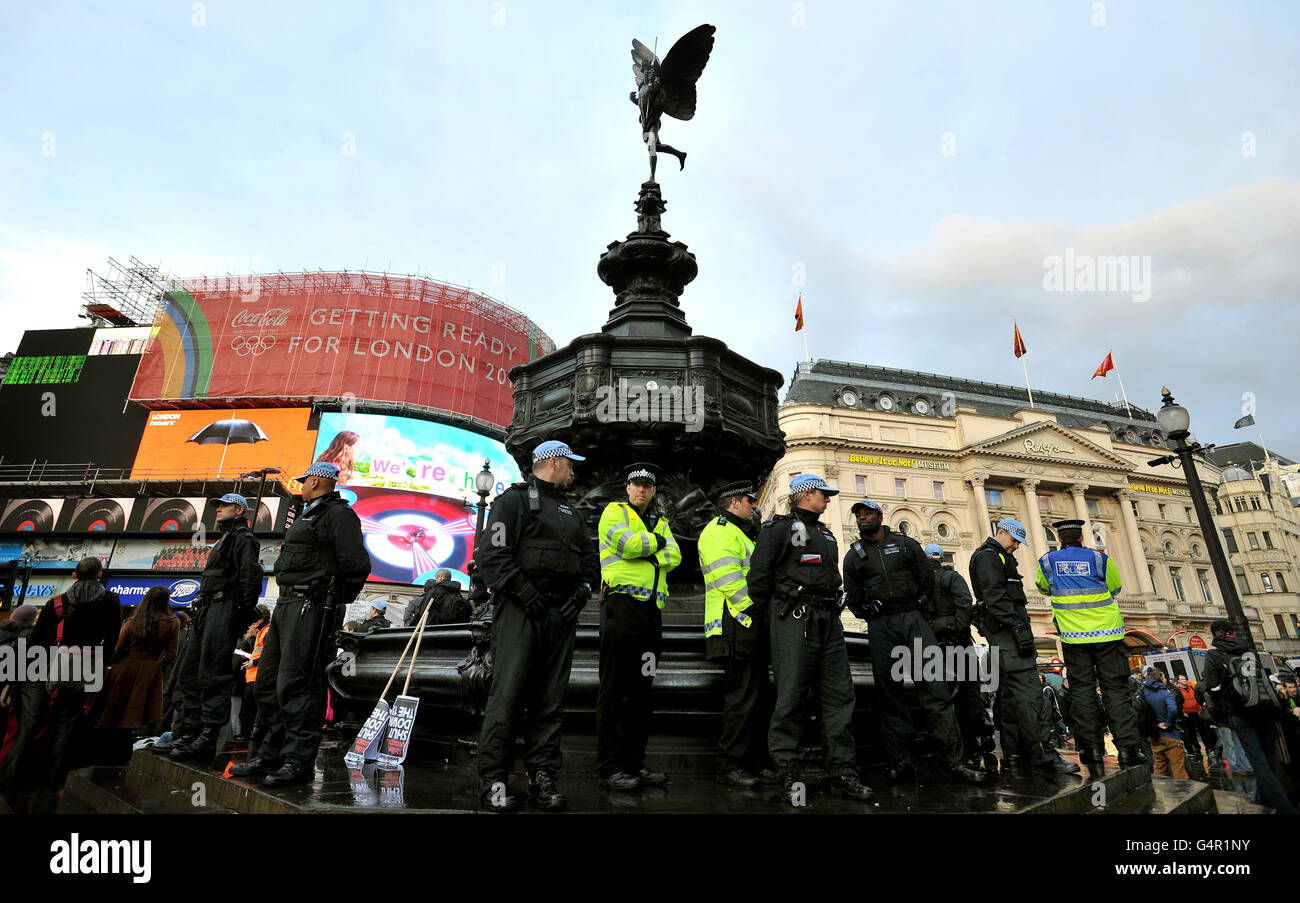 Police watch over protestors, believed to be from UK Uncut, gathered at ...