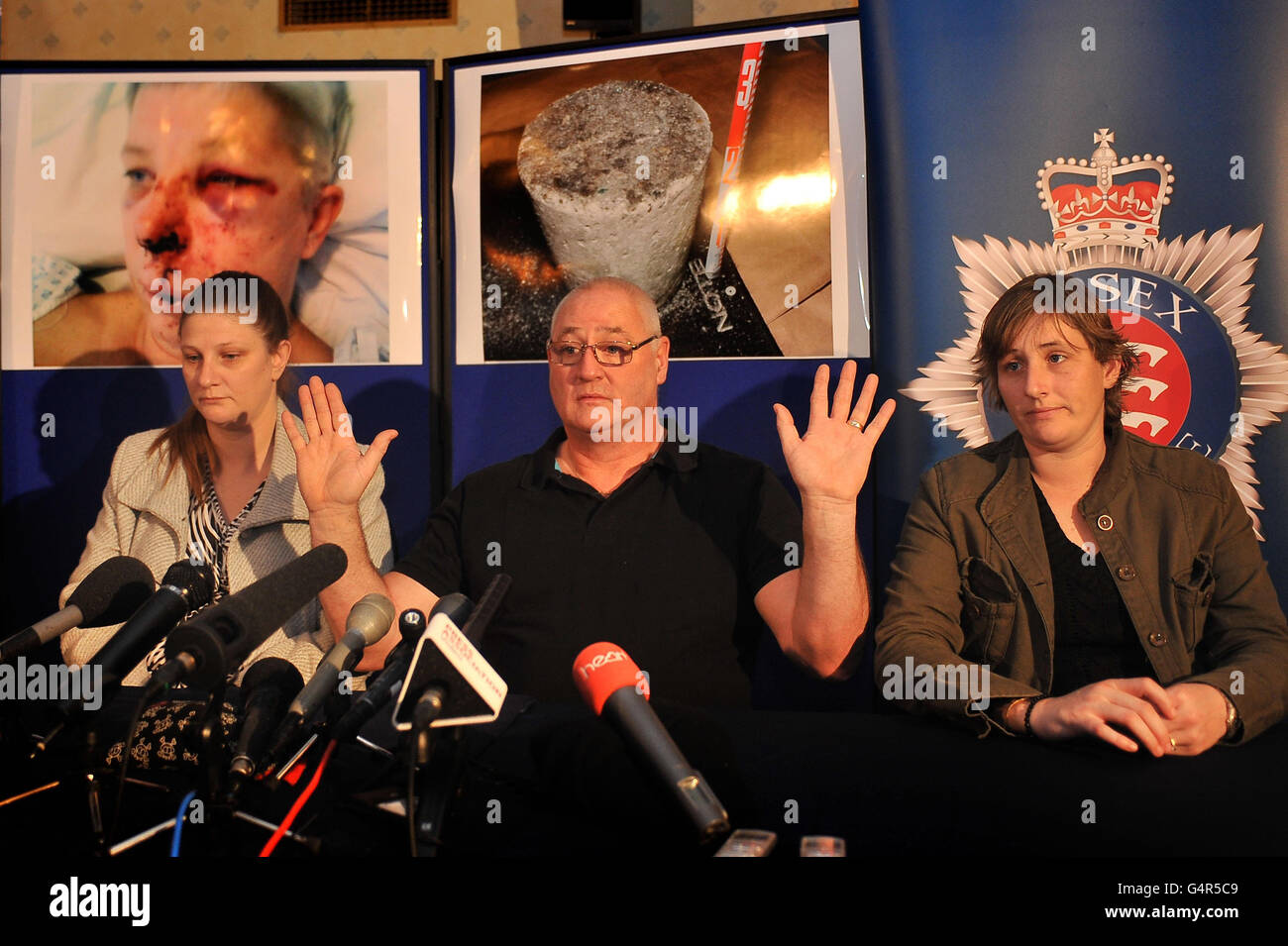 Steve Manley, with daughters Michelle, (left), and Sarah, address a ...